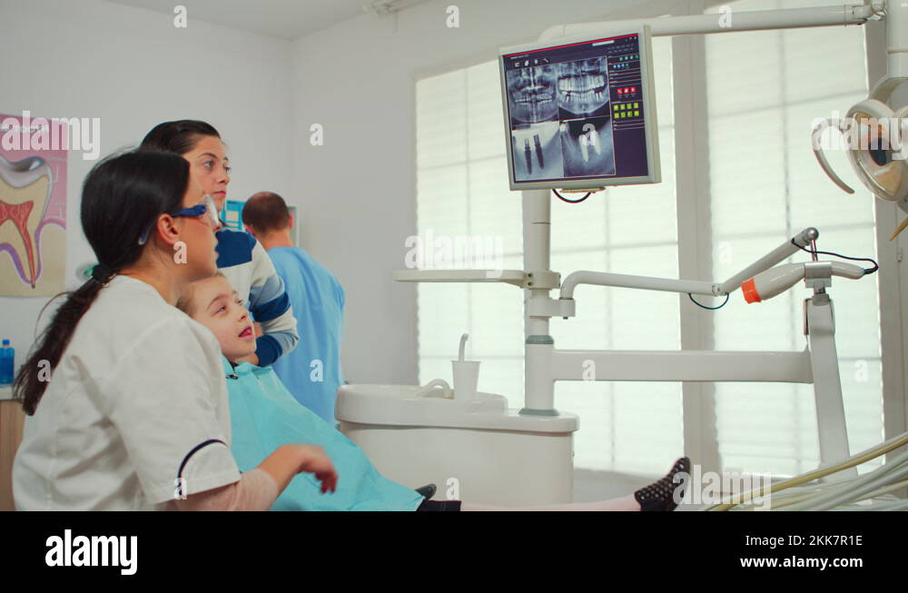 Pediatric dentist showing on monitor teeth x-ray Stock Video Footage ...