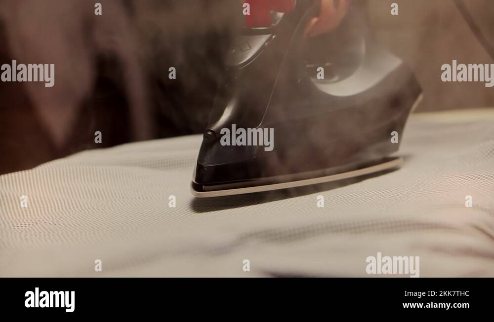 Ironing Clothes On Ironing Board.Hand With Iron Housework.Iron Steam ...