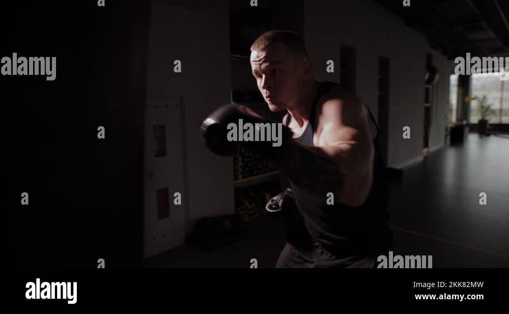 Boxer hitting a punching bag, slow motion at 120 fps in 4k Stock Video ...