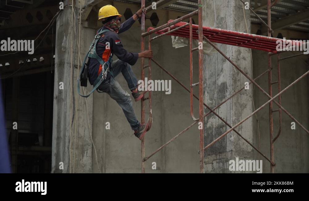 Indonesian construction workers building construction Stock Videos ...