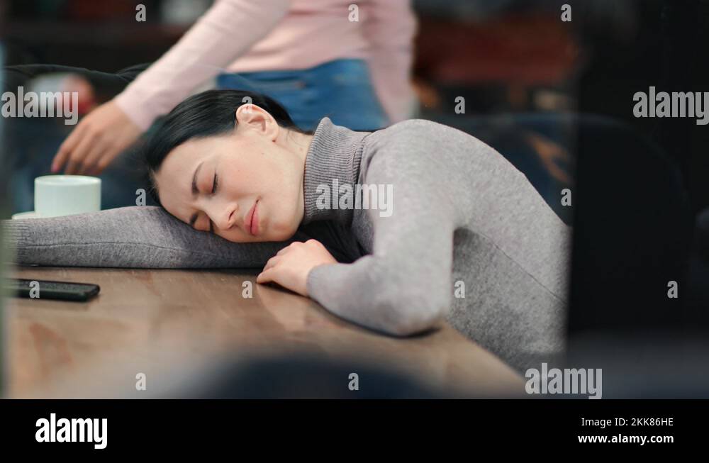 Upset Asian woman crying broken heart lying on table at evening ...