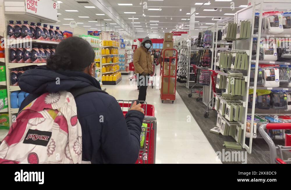 A Latinx Shopper Pushing Her Cart Down the Isle at Target During Cov ...