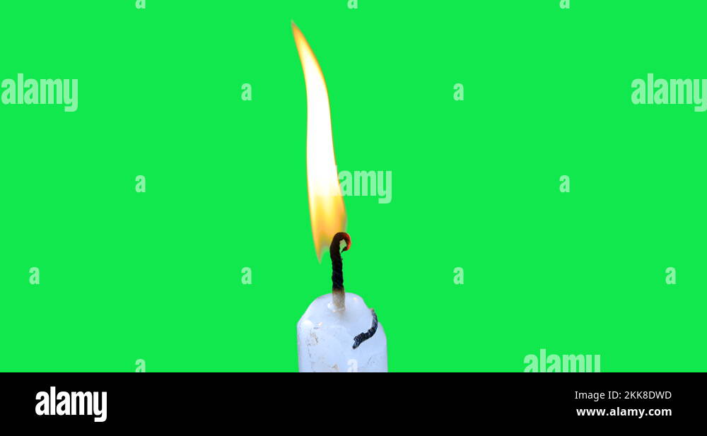 Burning Candle against green screen chroma key. Real flame from the ...