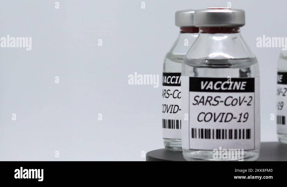 Rotating Vaccine Vials In Plain Background - Sars-Cov-2 Immunization ...