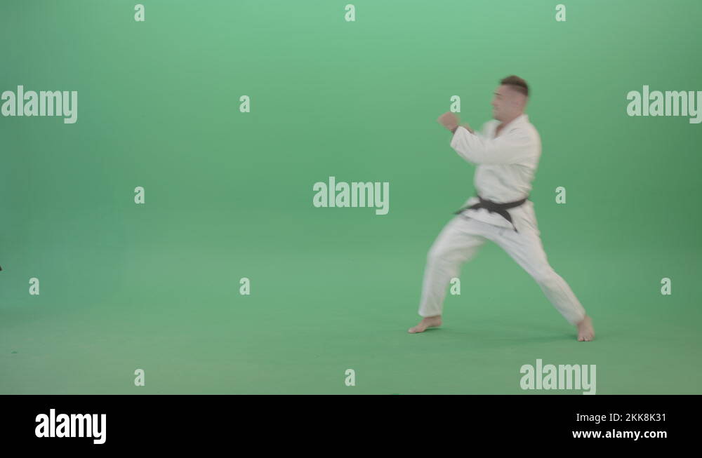 Karate Sport man make side kick isolated on green screen Stock Video ...