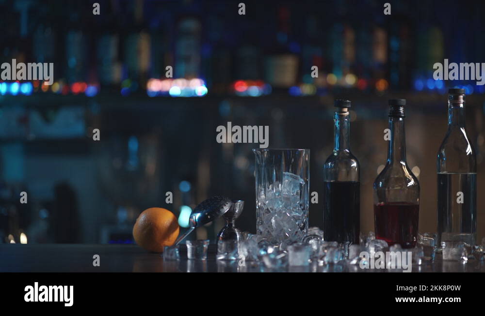 set of ingredient for negroni cocktail with ice, orange, rum, vodka and ...