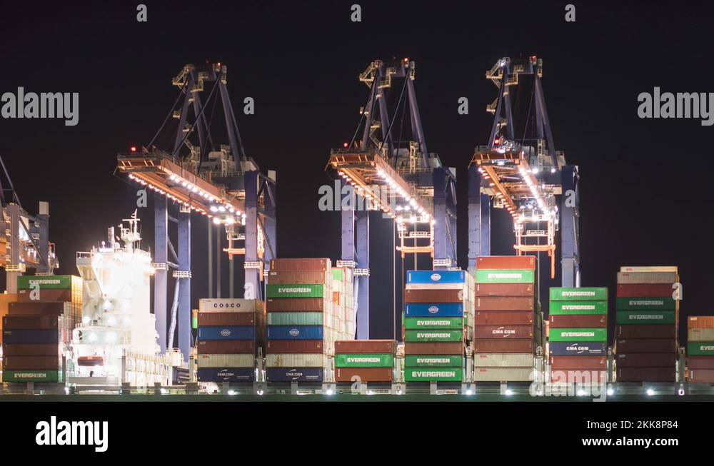 Port cranes time lapse loading container ship freight at port terminal ...