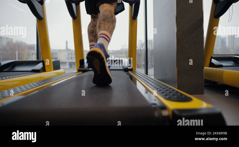 Legs of man running on a treadmill in gym, slow motion Stock Video ...