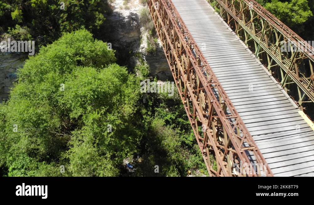a rusted metal bridge in the middle of the forest in cyprus. with cool ...