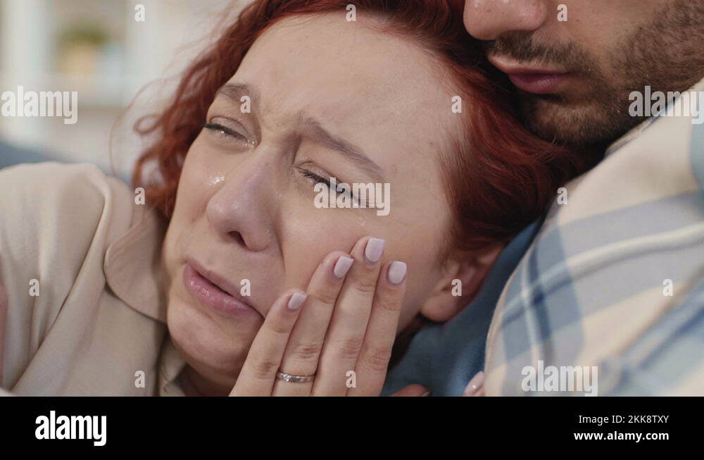 Girl Weeping in Arms of Partner Stock Video Footage - Alamy