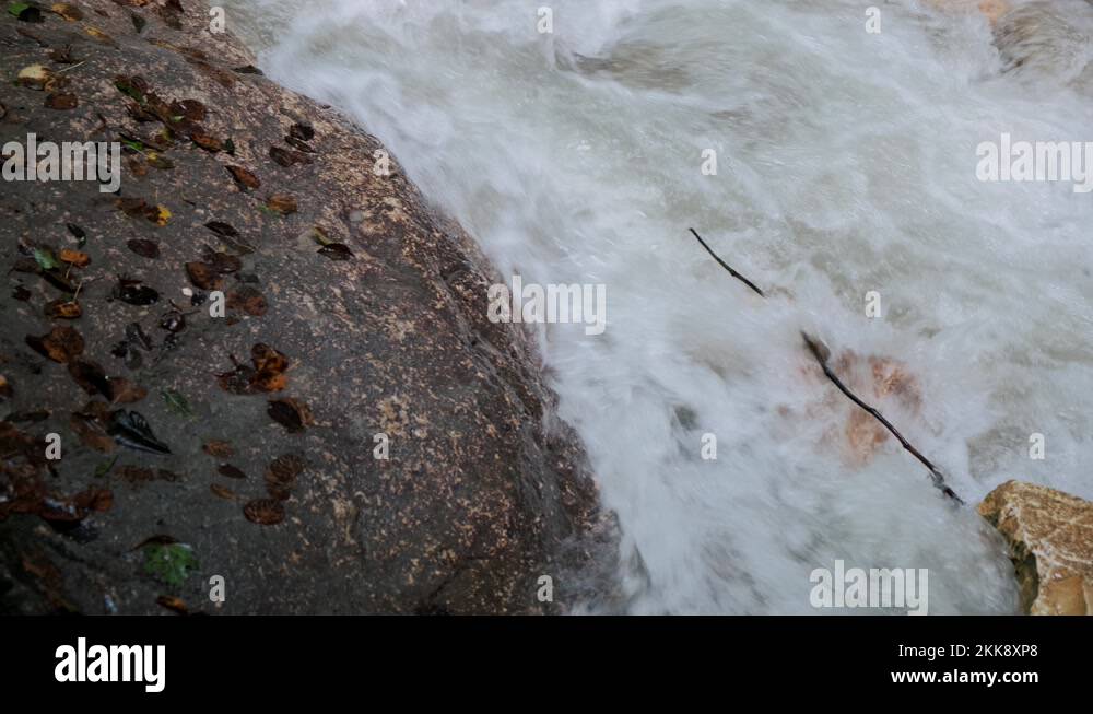 Fast movement foamy cold water stream of natural mountain river Stock ...