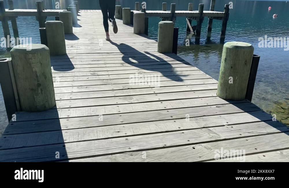 Girl on a jetty Stock Videos & Footage - HD and 4K Video Clips - Alamy