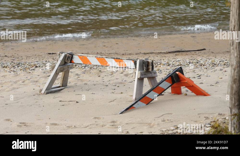 Sand Covering Barricade Fence On Beach, Erosion From Rising Sea Levels ...