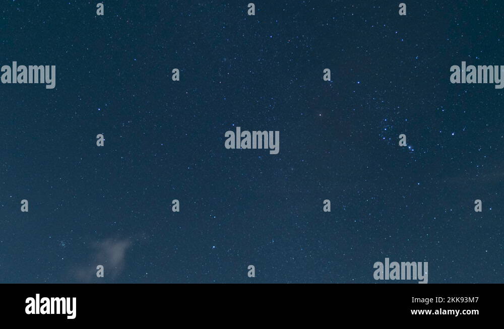 Wispy clouds fly between Earth and and the heavenly stars in this Stock ...