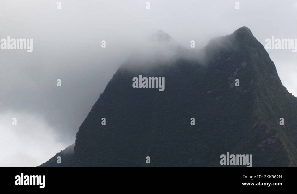 Peak of Mount Rotui covered by clouds, Moorea, French Polynesia Stock ...