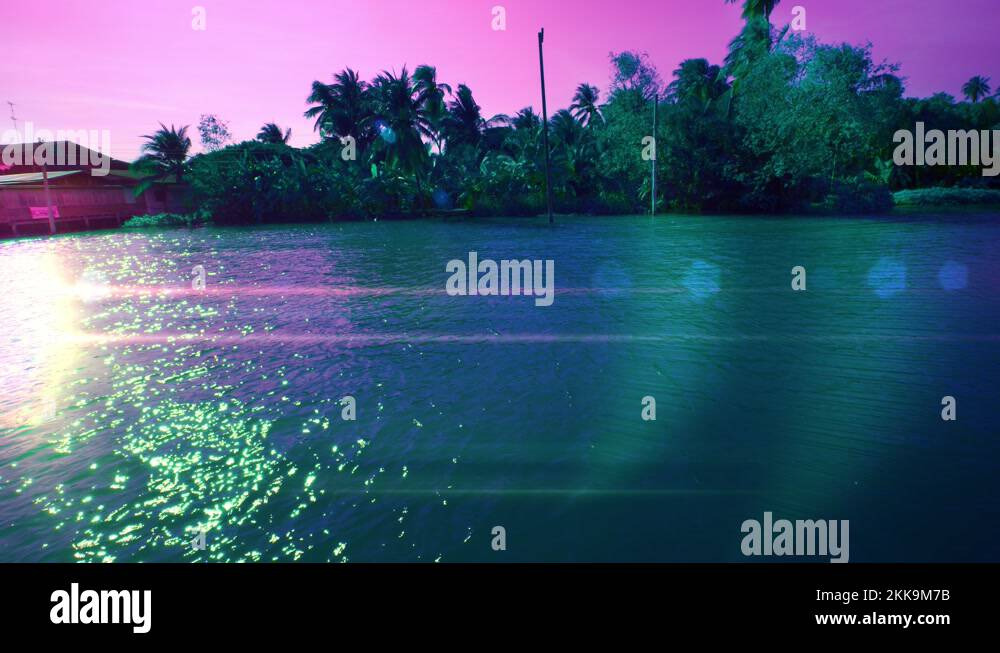 Tropical landscape is pastel color with an anamorphic lens flare from ...