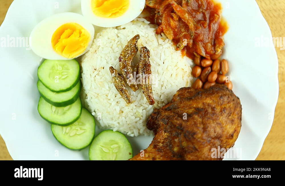 Nasi lemak (fragrant rice dish cooked in coconut milk and pandan leaf ...