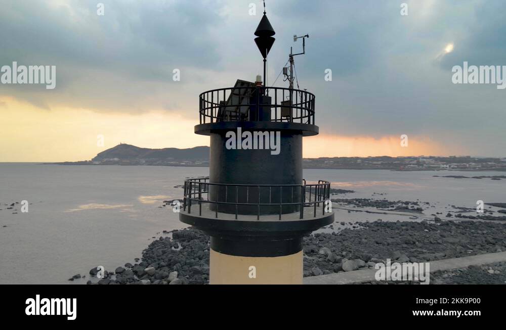 Orbiting Camera View of Udo Island behind a Lighthouse, Udo-biyangdo ...