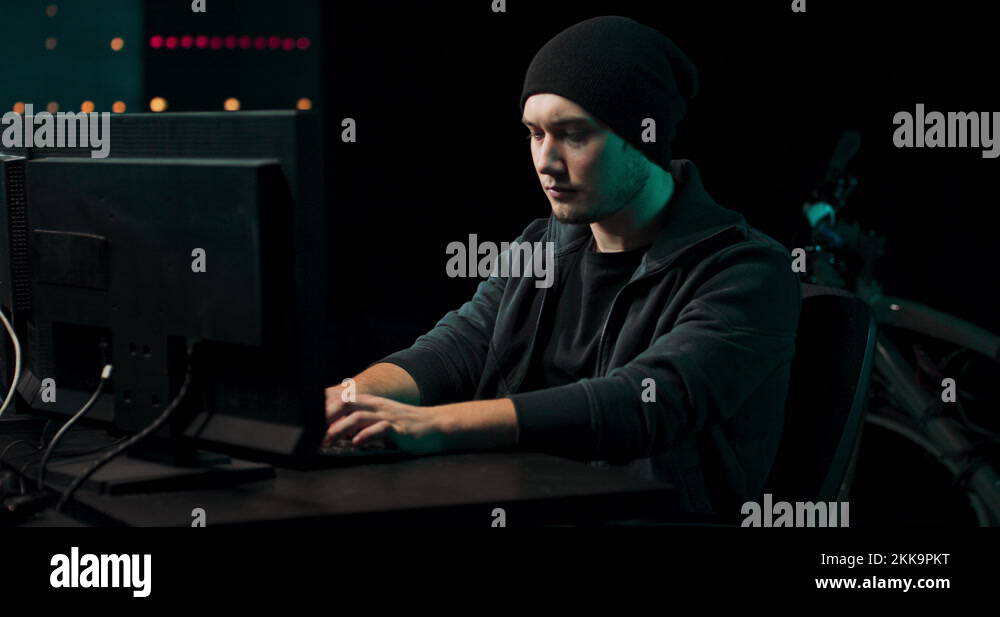 Young Professional Male Hacker Using Keyboard Typing Bad Data Into