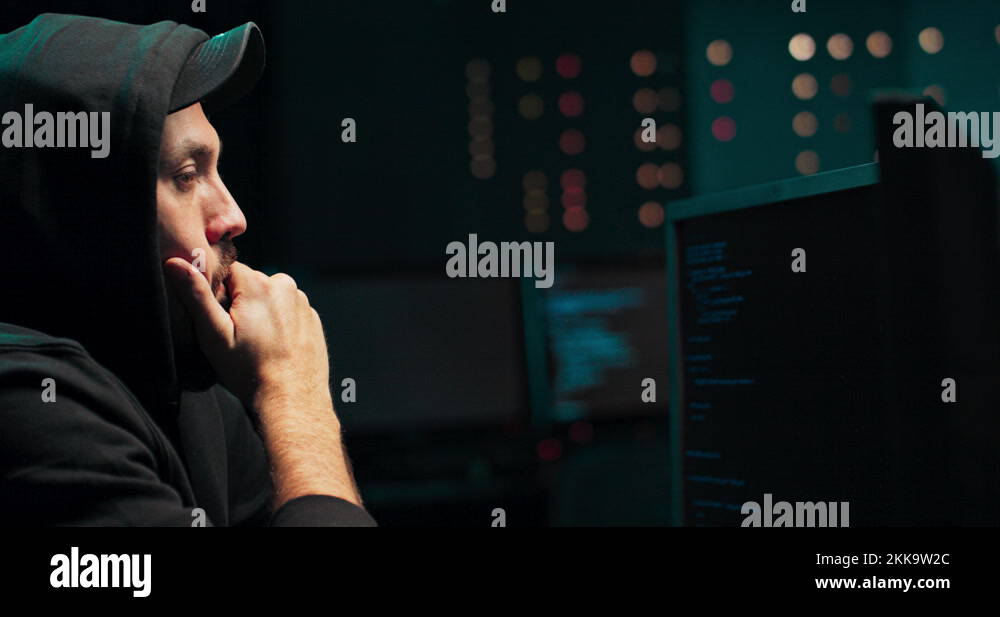 A middle-aged, bearded hacker in a hoodie breaks into the company's ...