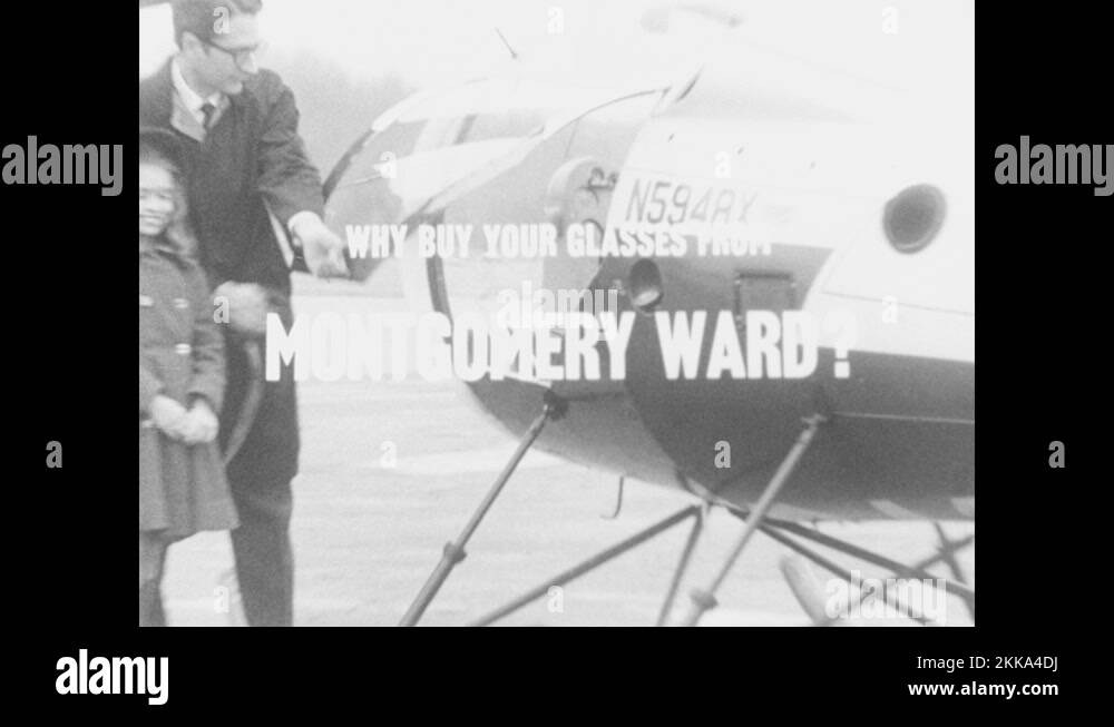 1960s: Person opens cockpit of helicopter. Man helps two children and ...