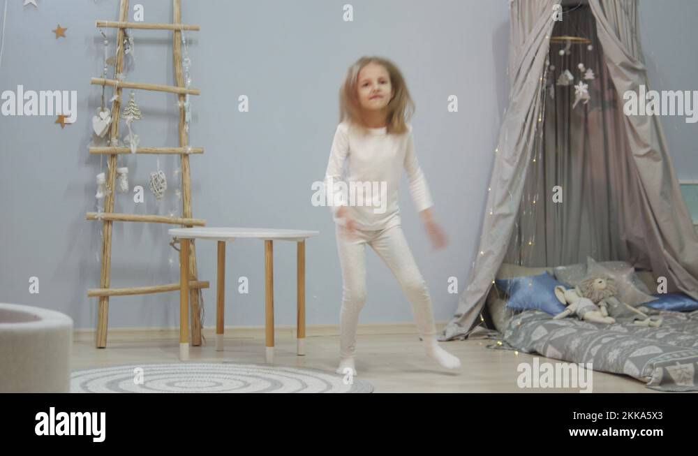 Funny adorable happy kid girl dancing, cute little caucasian child ...