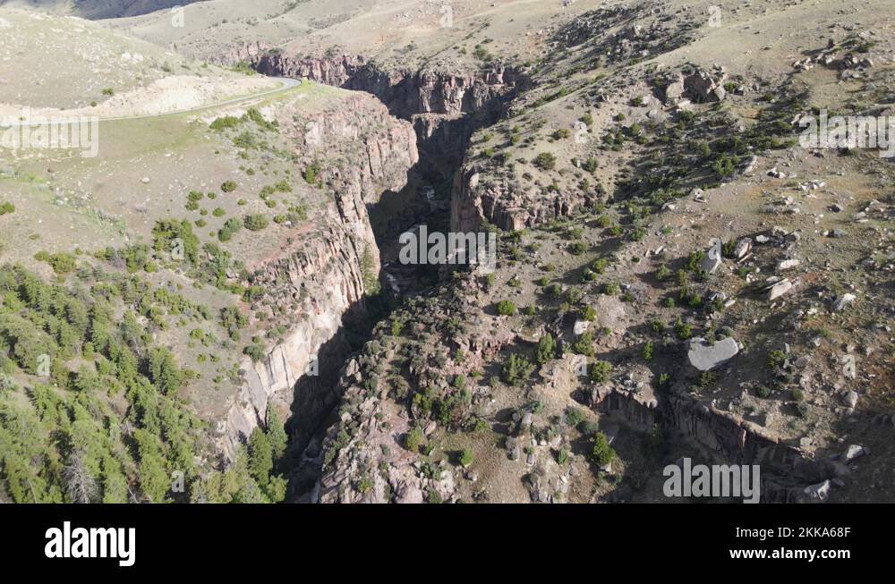 Tilting aerial view of Shell Creek and its high canyon walls along ...