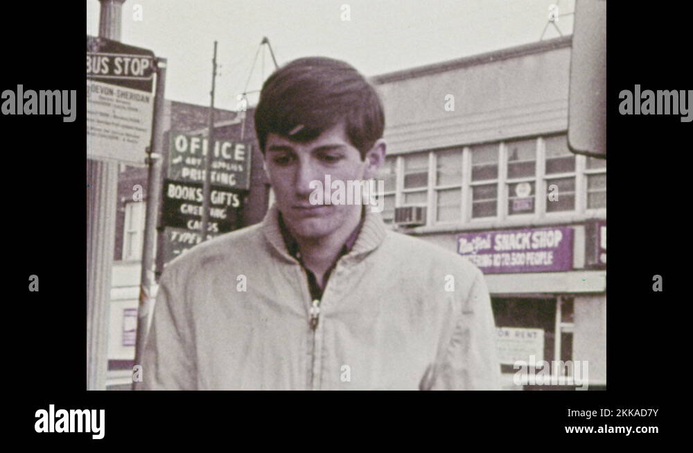 1960s: Sign in window. Boy on sidewalk, walks away. Sign outside ...