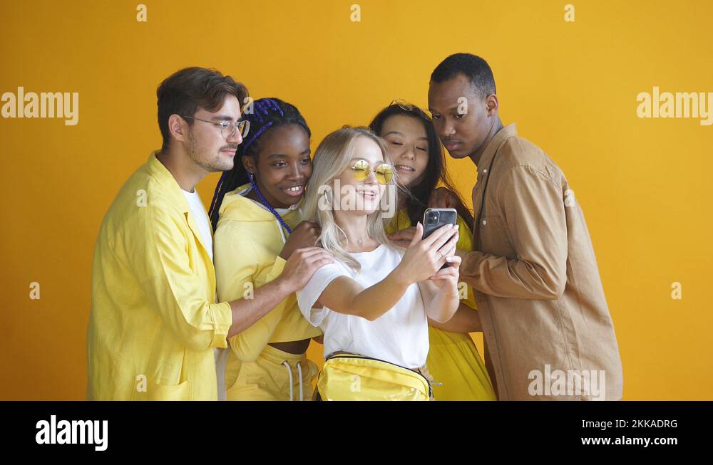 Good-looking people of different nationalities races take photo of ...