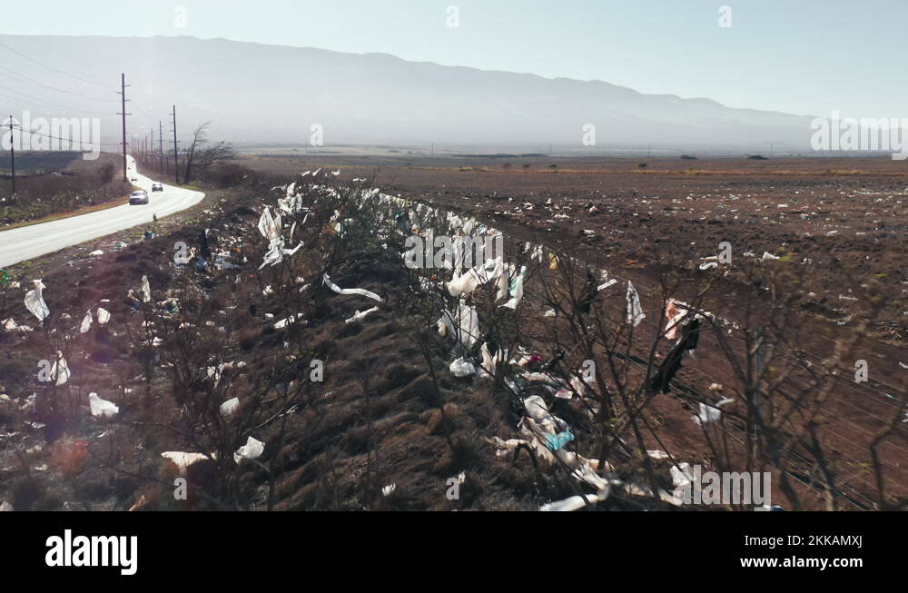 Plastic pollution trash on countryside field with different kinds of ...