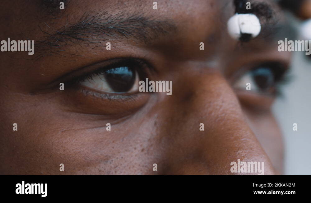 Eyes of african american black man with braided haor. Confident face ...