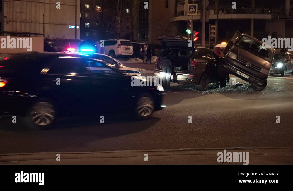 Collision of two cars. Police car at the scene of an accident on the ...