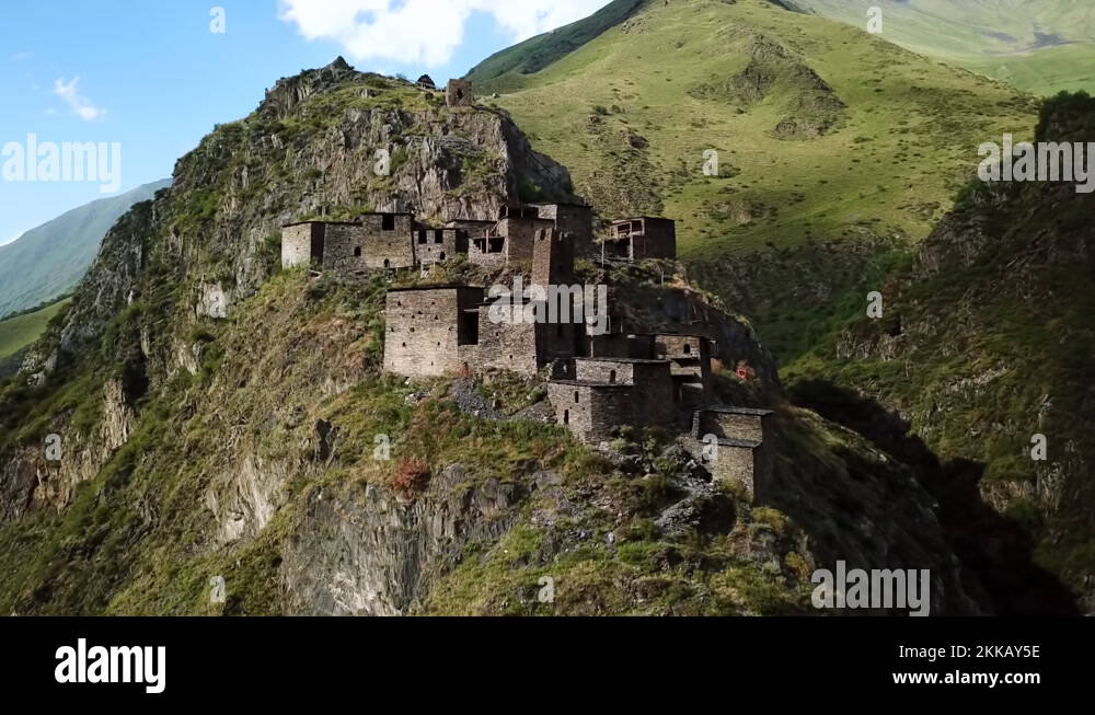 Shatili valley ancient tower ruins landmark on mountain slope drone ...