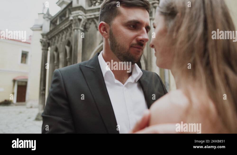 Young caucasian bride and groom making a kiss in park Wedding family ...