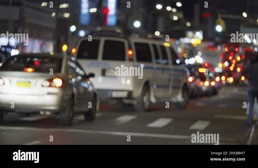 New York City heavy street traffic by night, queue of waiting cars ...