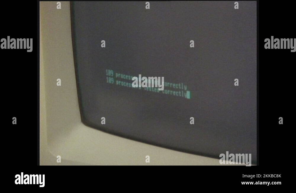 1990s: Two people seen in window of apartment. Computer screen. Two men ...