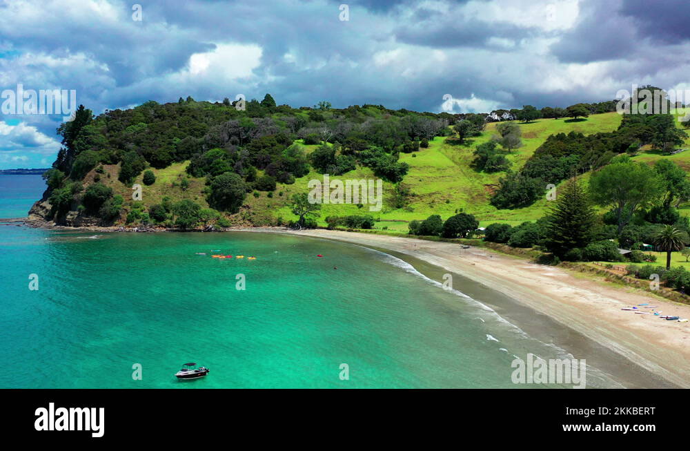 Turquoise Blue Sea At Te Muri Beach With Mahurangi Regional Park In ...