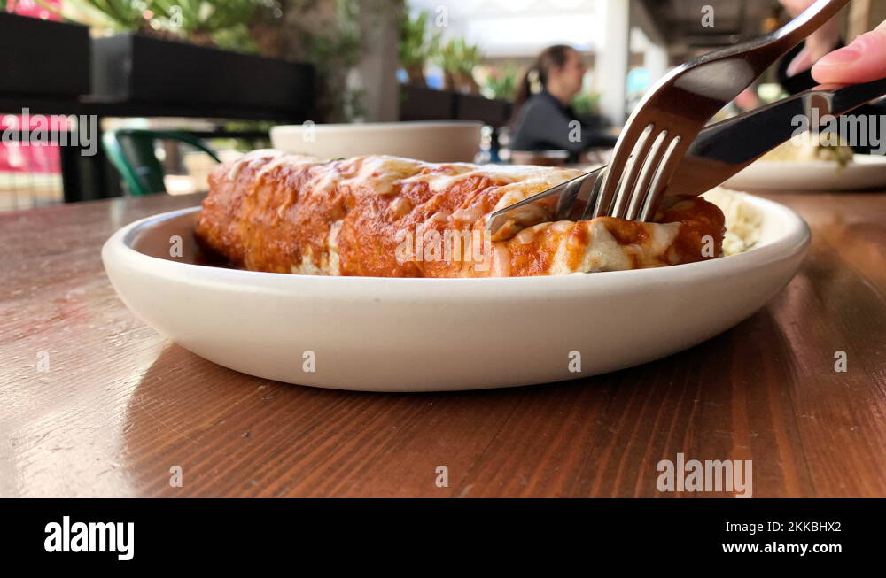 Eating a burrito Stock Videos & Footage - HD and 4K Video Clips - Alamy