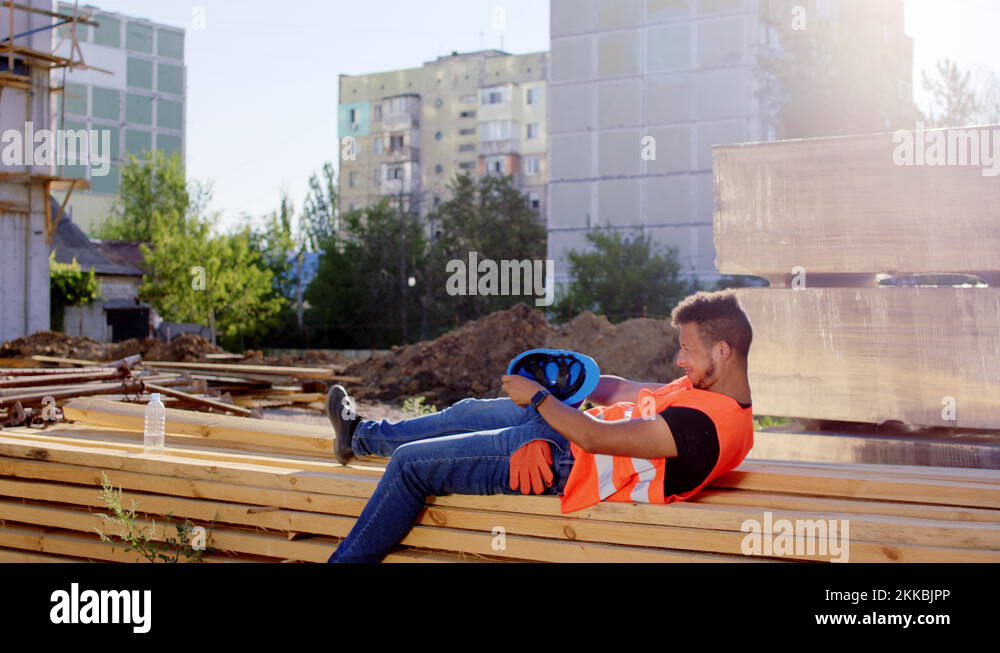 Sleeping at work tired construction worker Afro American he wake up ...