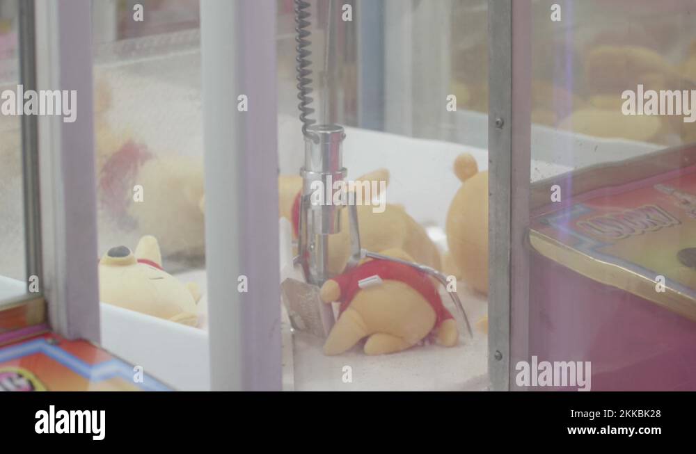 Claw Dropping and Pick Up Bear Doll, Then Doll Drop into Prize Hole in ...