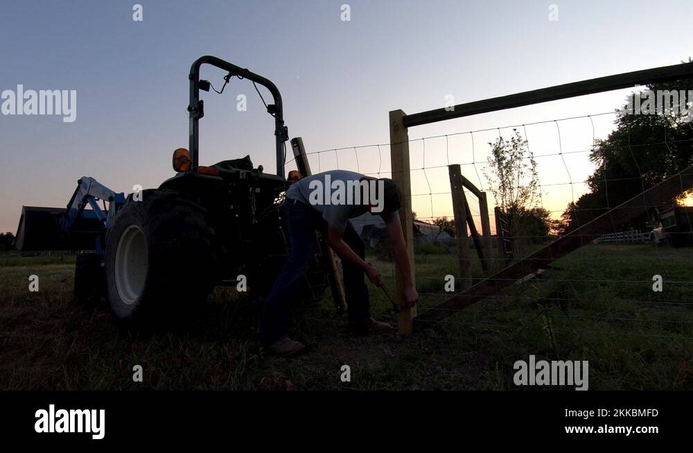 Man fixing fence Stock Videos & Footage - HD and 4K Video Clips - Alamy
