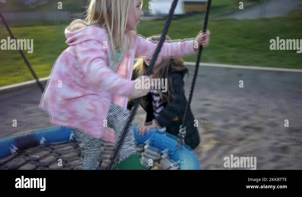Two girls swing Stock Videos & Footage - HD and 4K Video Clips - Alamy
