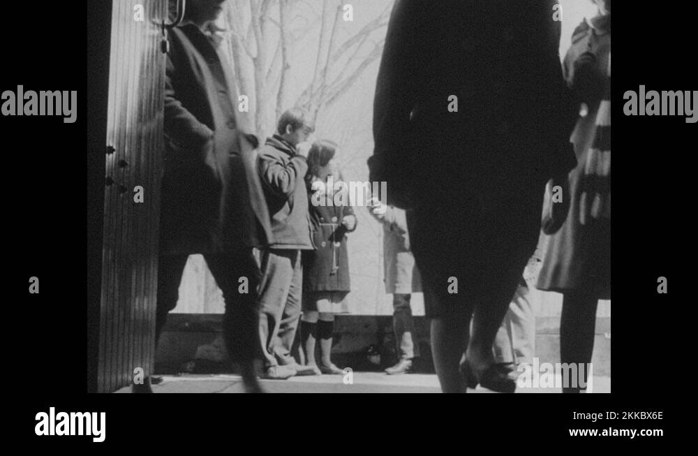 1960s: Students talk outside campus building, Man speaks at lectern ...