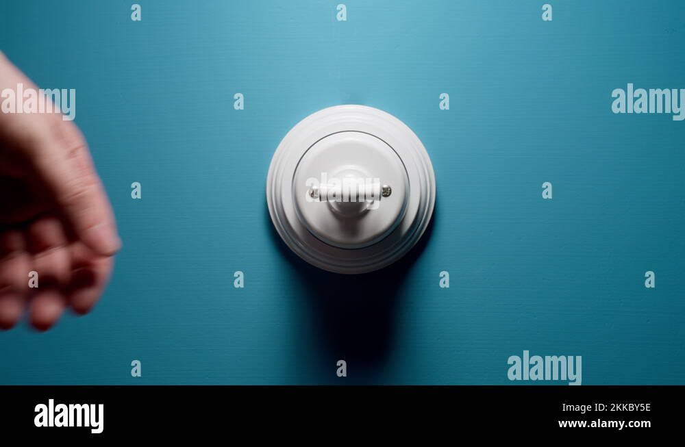 Light Is Off - Human hand Switches Off A Toggle Switch On The Blue Wall ...