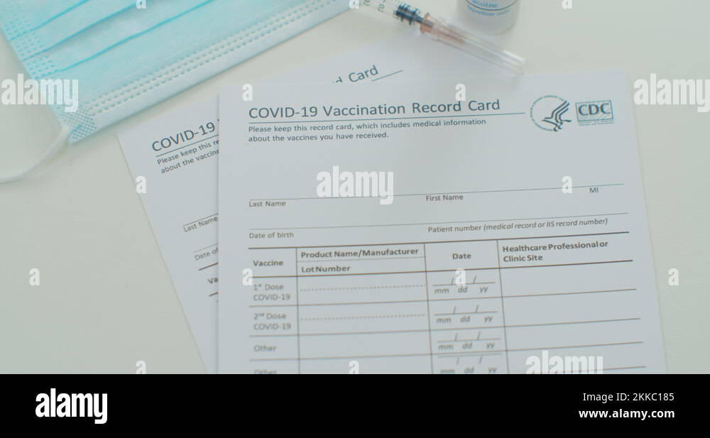 Medical mask and COVID-19 vaccine on vaccination record card approved ...