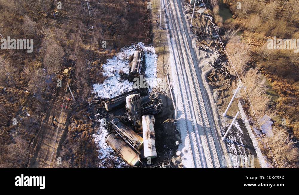 A train wreck on a railroad, scattered cisterns from collisions and ...