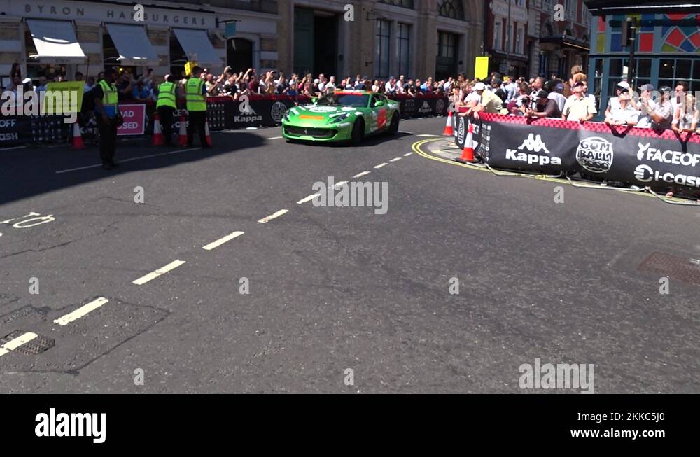 Crowd watching Ferrari 458 Italia super car at famous Gumball 3000 ...