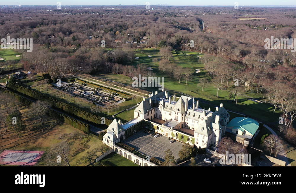 An aerial view over a large, upscale, luxury mansion with an eight ...