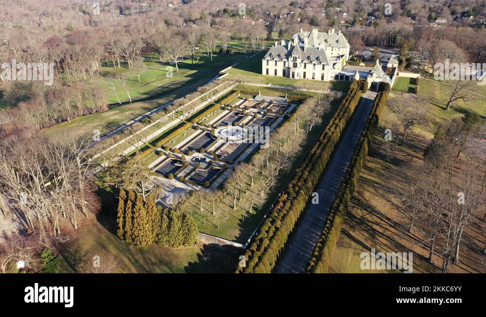 An aerial view over a large, upscale, luxury mansion with an eight ...