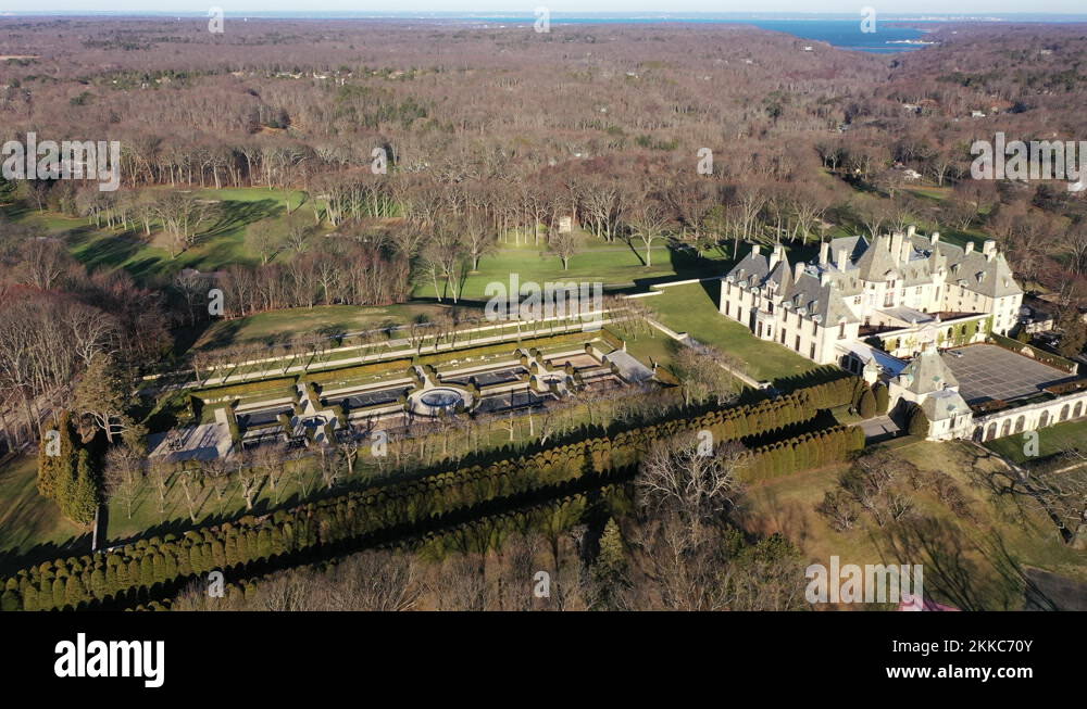 An aerial view over a large, upscale, luxury mansion with an eight ...